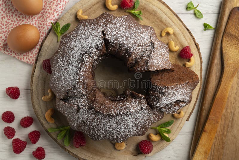 Delicious and Fluffy Round Chocolate Cake with Cashews and Raspberries ...