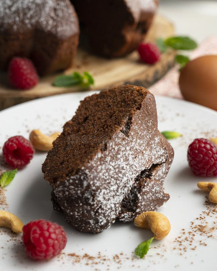 Delicious and Fluffy Round Chocolate Cake with Cashews and Raspberries ...