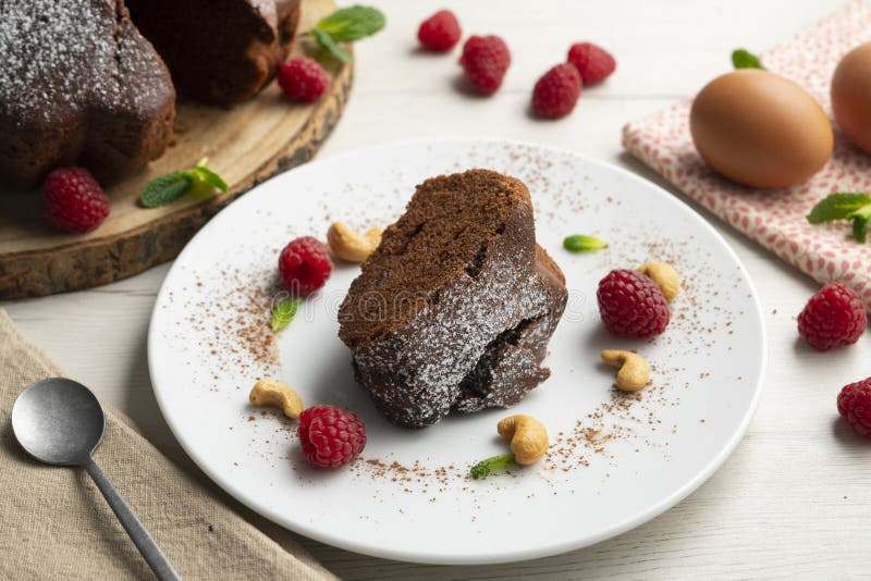 Delicious and Fluffy Round Chocolate Cake with Cashews and Raspberries ...