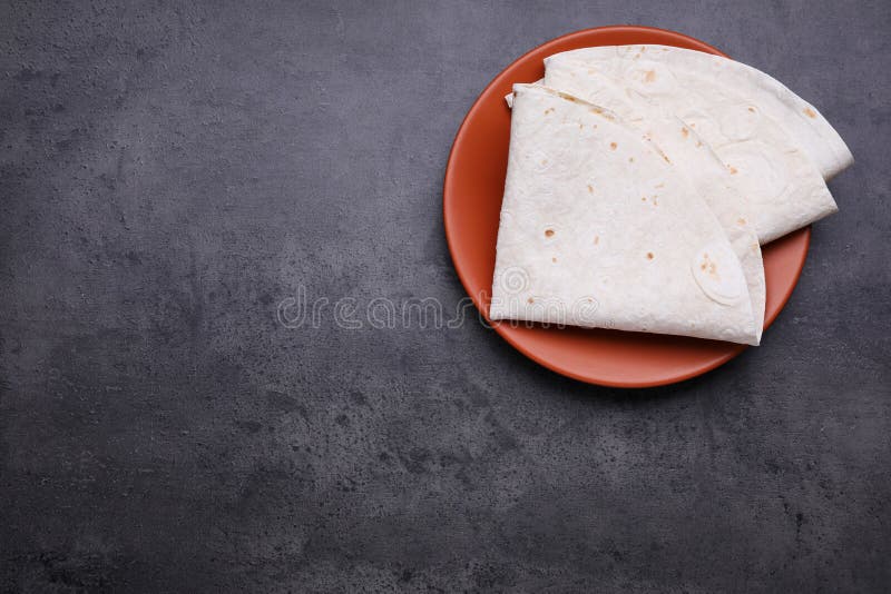Delicious Folded Armenian Lavash on Dark Table, Top View. Space for ...