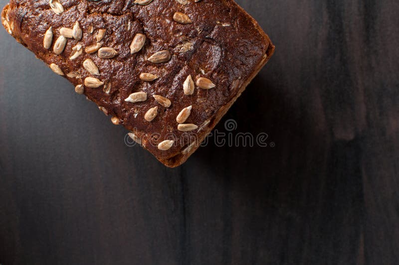 Delicious Fresh Baked Bread with Bran Sunflower Seeds on a Dark Table ...