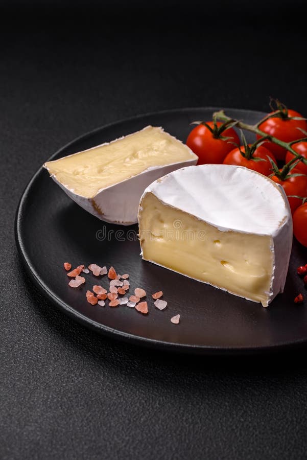 Delicious Fresh Brie Cheese in the Form of a Mini Head with Cherry ...