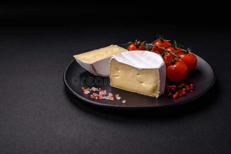 Delicious Fresh Brie Cheese in the Form of a Mini Head with Cherry ...