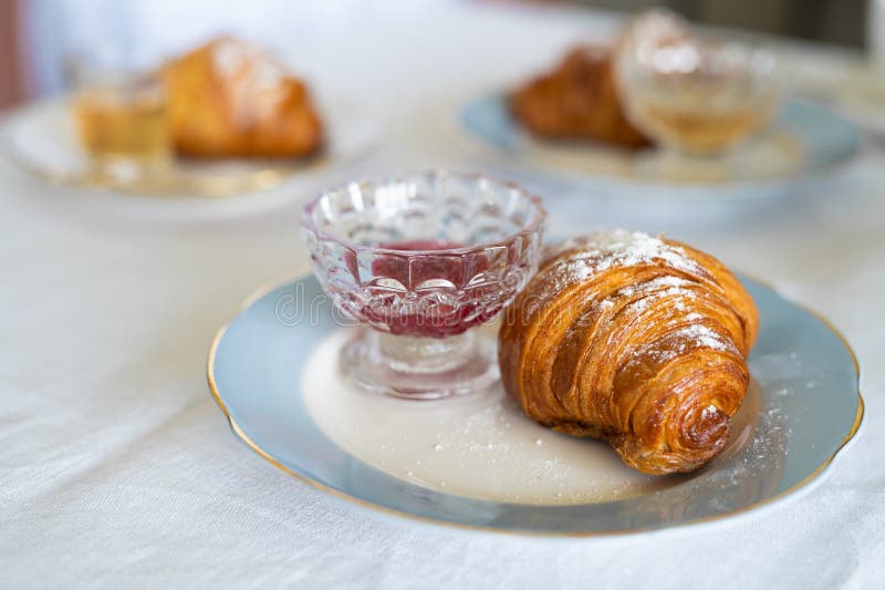Delicious Fresh Croissant on a Plate at the Table Stock Image - Image ...