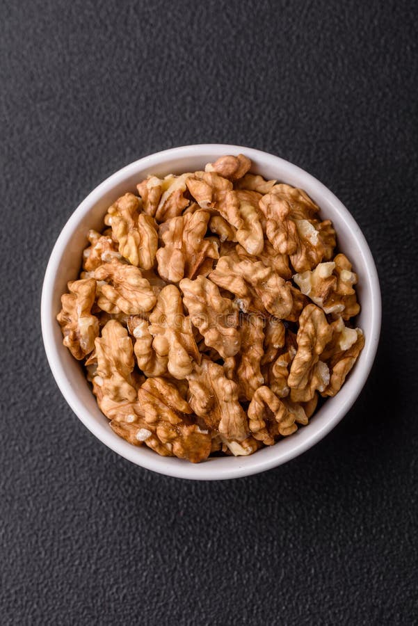 Delicious Fresh Peeled Raw Walnuts in a Ceramic Plate Stock Image ...