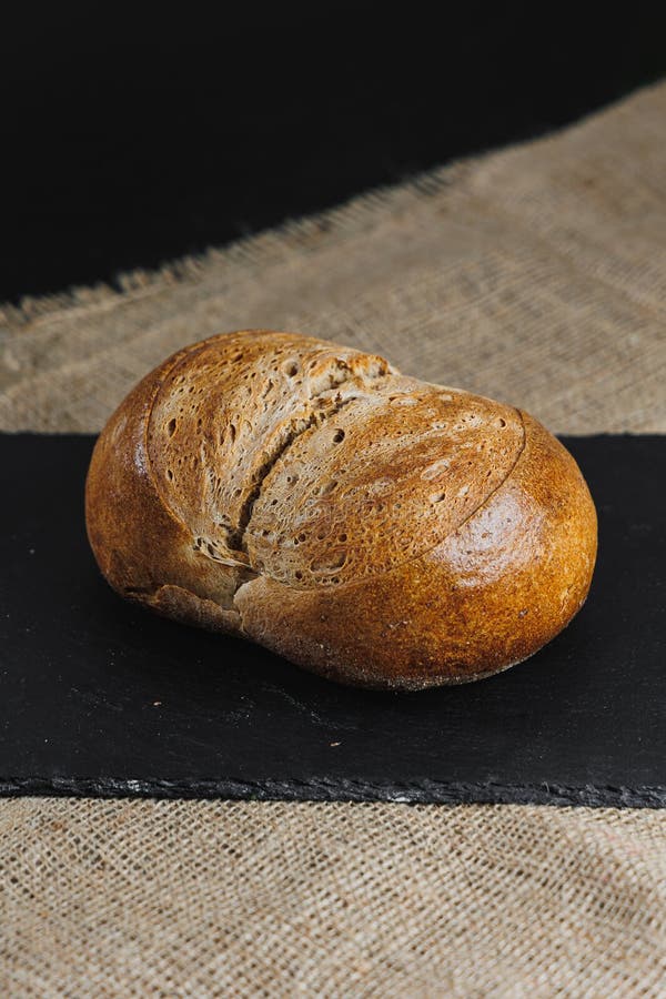 Delicious Fresh Rye Round Bread on a Dark Background. Crispy Fresh ...