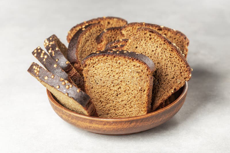 Delicious and Fresh Sliced Rye Bread in Pieces in a Plate Stock Photo ...