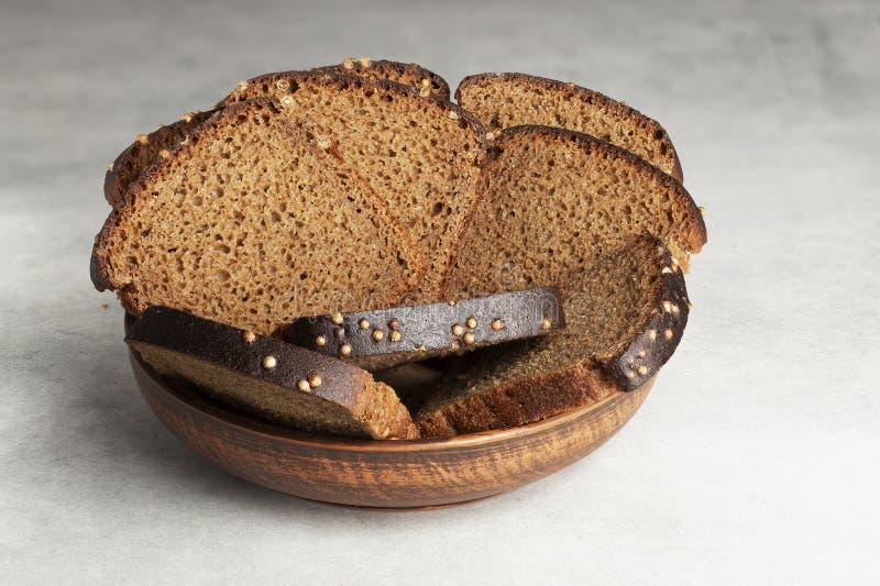 Delicious and Fresh Sliced Rye Bread in Pieces in a Plate Stock Image ...