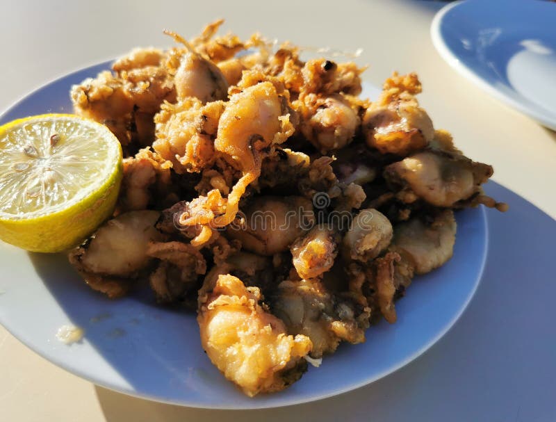Delicious Fried Baby Octopus with Lemon Stock Image - Image of dinner ...