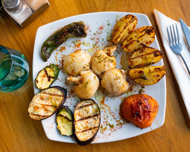 Delicious Fried Cuttlefish with Grilled Vegetables on Plate Stock Photo ...