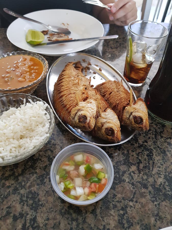 Delicious Fried Fish with Rice and Beans Stock Photo - Image of ...