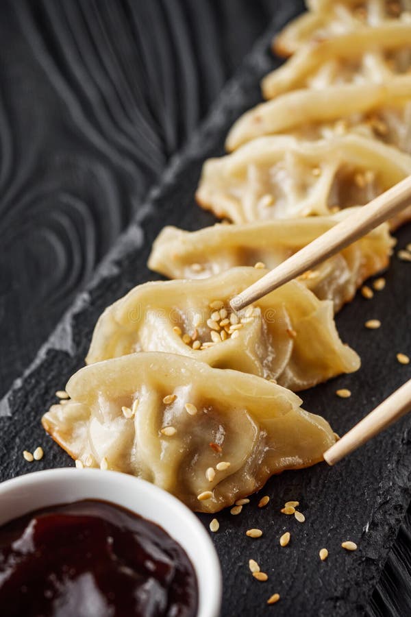 Delicious Fried Gyoza Dumplings on a Black Plate Stock Image - Image of ...