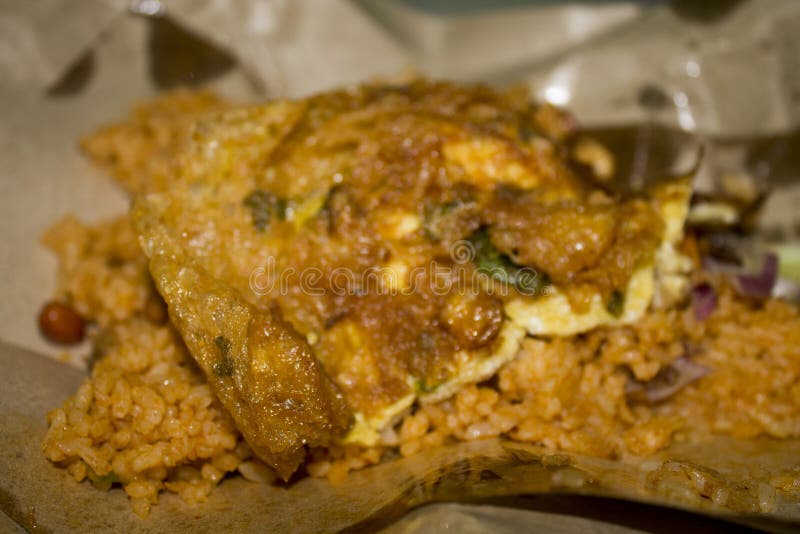 Delicious Fried Rice with Omelette on Wrapping Paper Stock Photo ...