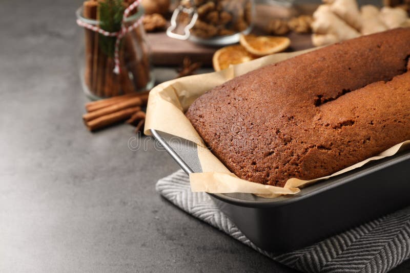 Delicious Gingerbread Cake in Baking Dish on Grey Table, Space for Text ...