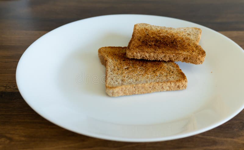 Delicious Golden Crispy Fried Bread Toasts on the Table and White Plate ...