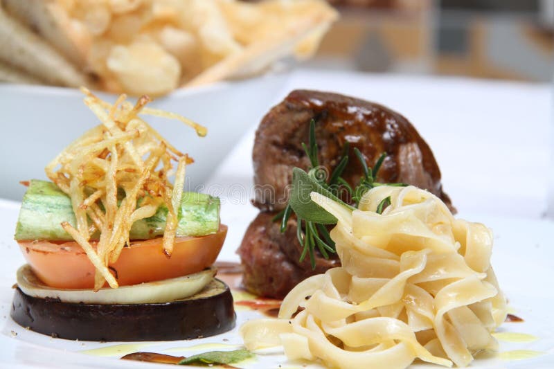 Delicious Gourmet Meal with Pasta, Meat and Vegetables Stock Image ...