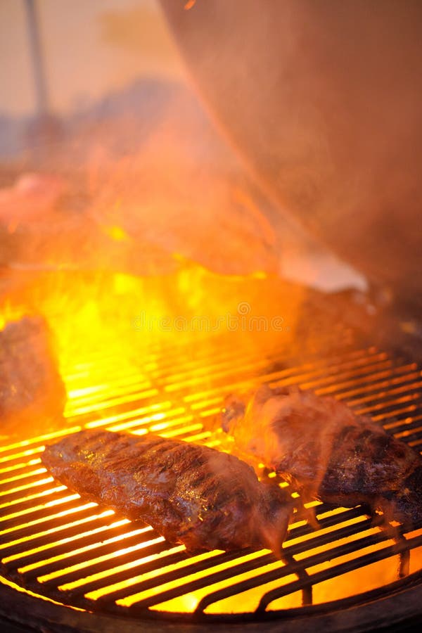 Delicious Grilled Beef Steak with Fire on Background Stock Image ...