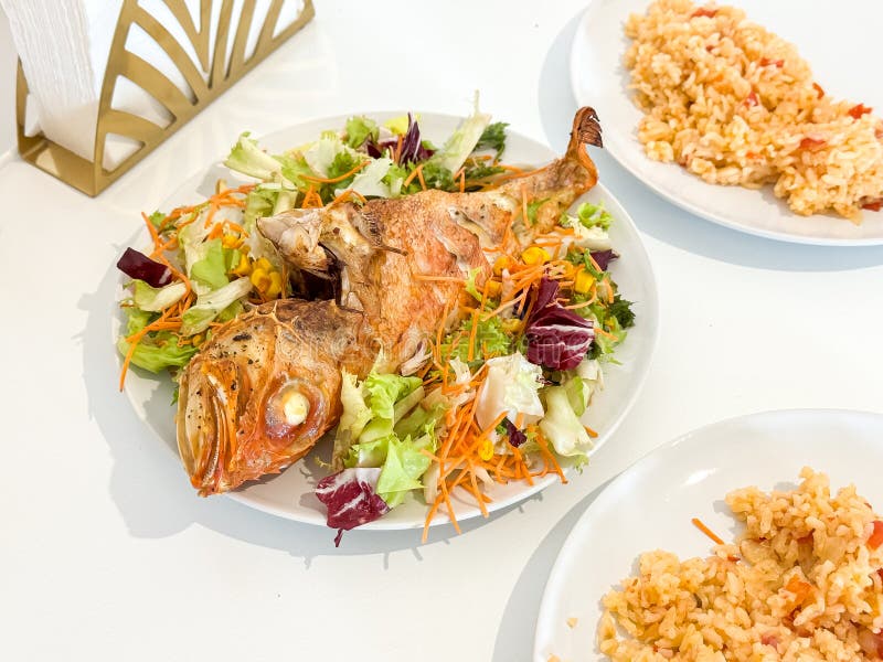 Delicious Grilled Fish on Fresh Salad with Rice Sides Stock Image ...