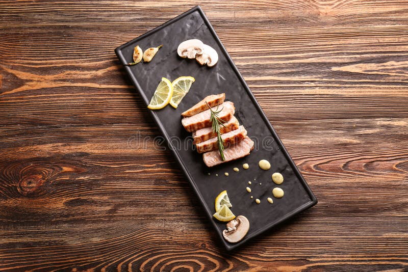 Delicious Grilled Meat with Lemon and Sauce on Tray Stock Photo - Image ...