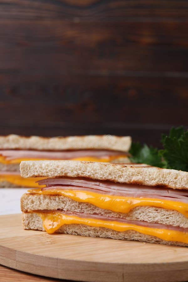 Delicious Grilled Sandwiches with Ham and Cheese on Table, Closeup ...