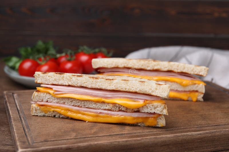 Delicious Grilled Sandwiches with Ham and Cheese on Table, Closeup ...