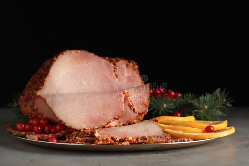 Delicious Ham Served for Christmas Dinner on Table Against Black ...