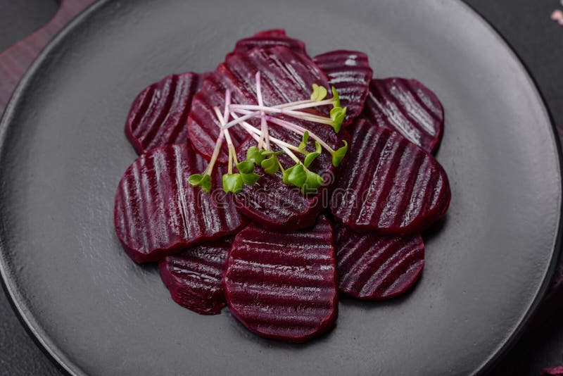 Delicious Healthy Boiled Ruby-colored Beets Sliced ??on a Black Plate ...