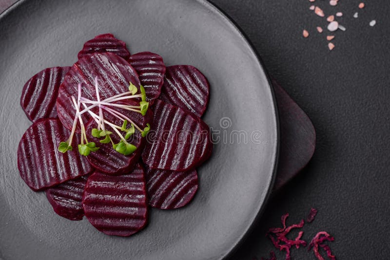 Delicious Healthy Boiled Ruby-colored Beets Sliced ??on a Black Plate ...
