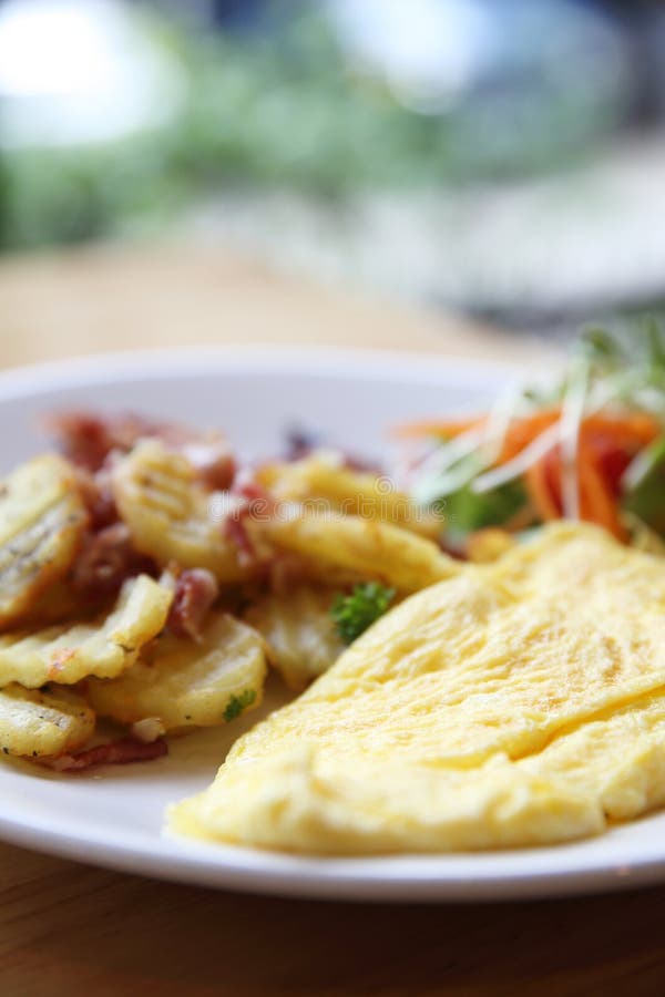 A Delicious Home Style Breakfast with Crispy Bacon, Eggs Omelette Stock ...