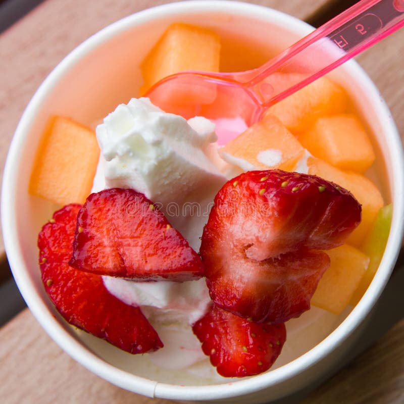 Delicious Ice Cream with Strawberry and Melon Topping Stock Image ...