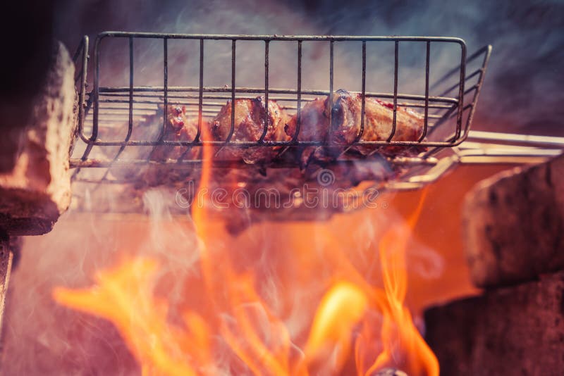 Delicious Juicy Meat on a Grill is Fried on a Fire Stock Photo - Image ...