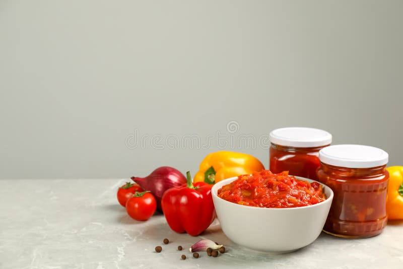 Delicious Lecho and Fresh Ingredients on Light Grey Marble Table. Space ...