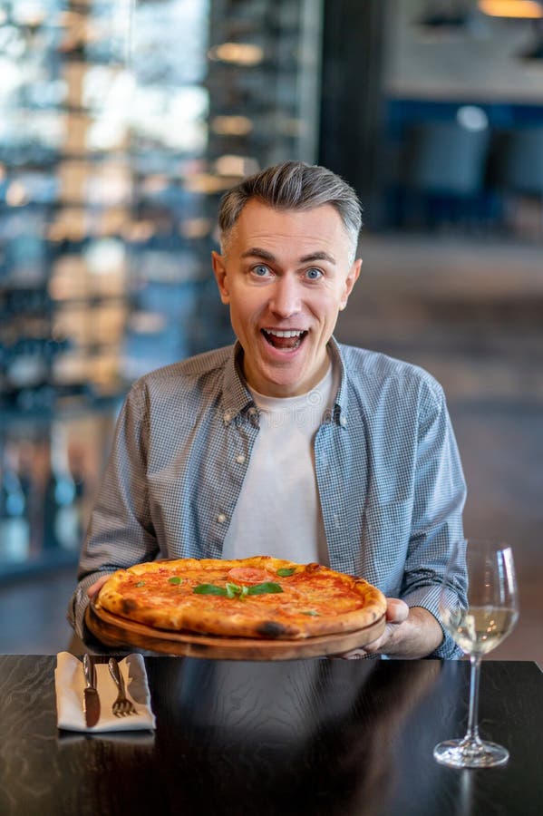 A Man Eating Pizza and Looking Excited Stock Image - Image of wellbeing ...