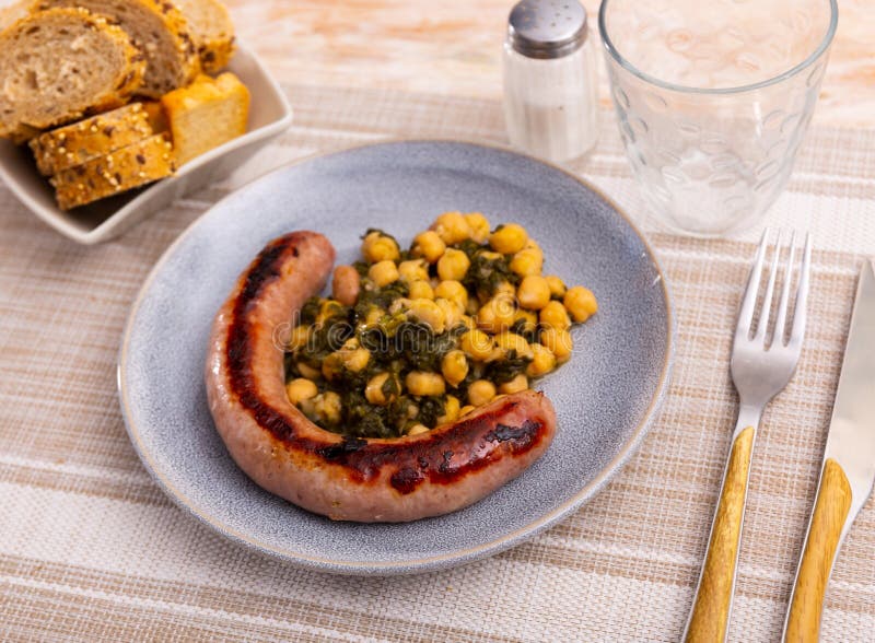 Delicious Lunch from Sausages, Chickpeas with Spinach Stock Photo ...