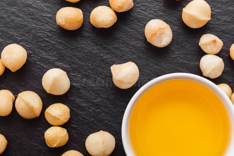 Delicious Macadamia Nuts on a Dark Stone Background Stock Photo - Image ...