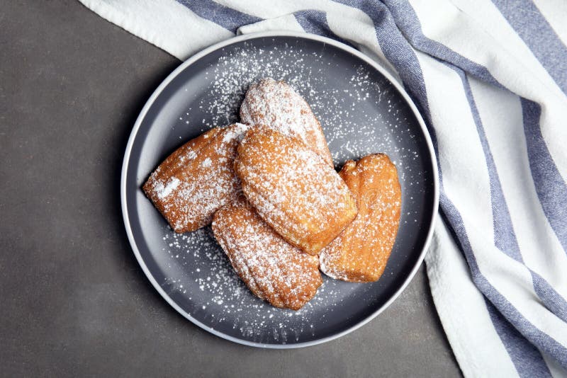 Delicious Madeleine Cakes with Powdered Sugar on Grey Table, Top View ...
