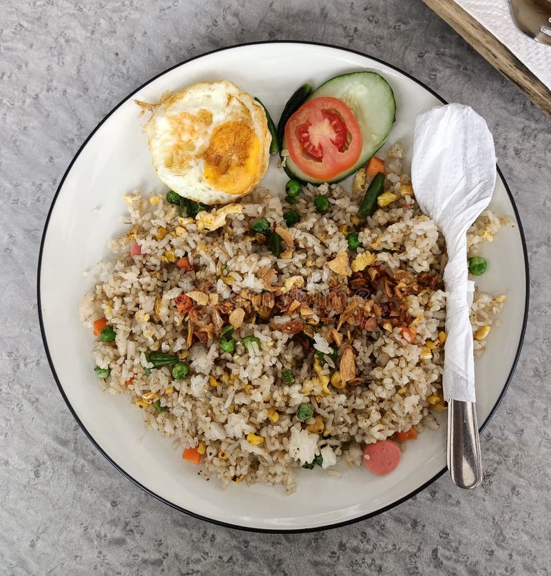 Breakfast with a Plate of Fried Rice at a Restaurant Stock Image ...