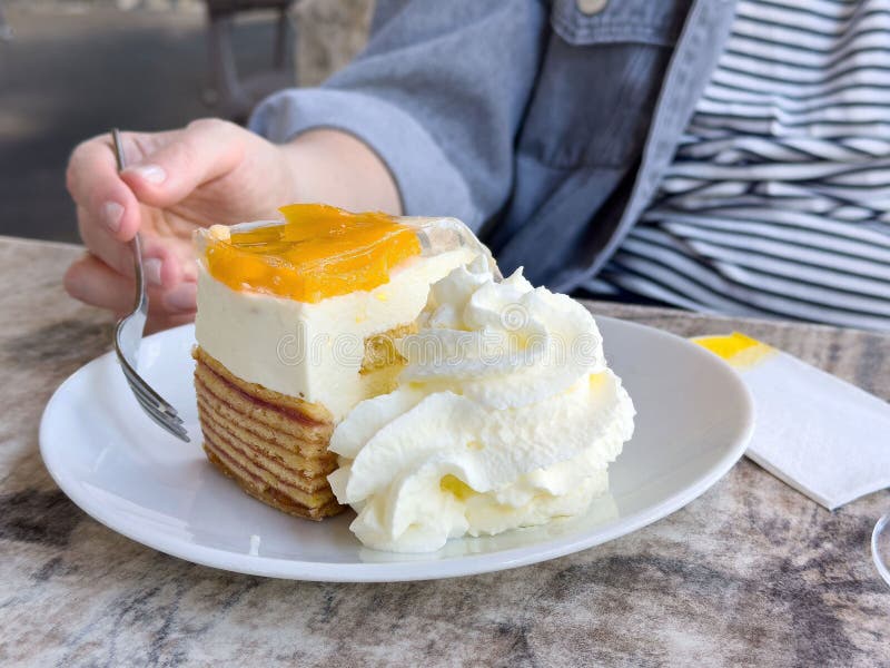 Delicious Mango Cream Cake with Whipped Topping and Layers on a Plate ...