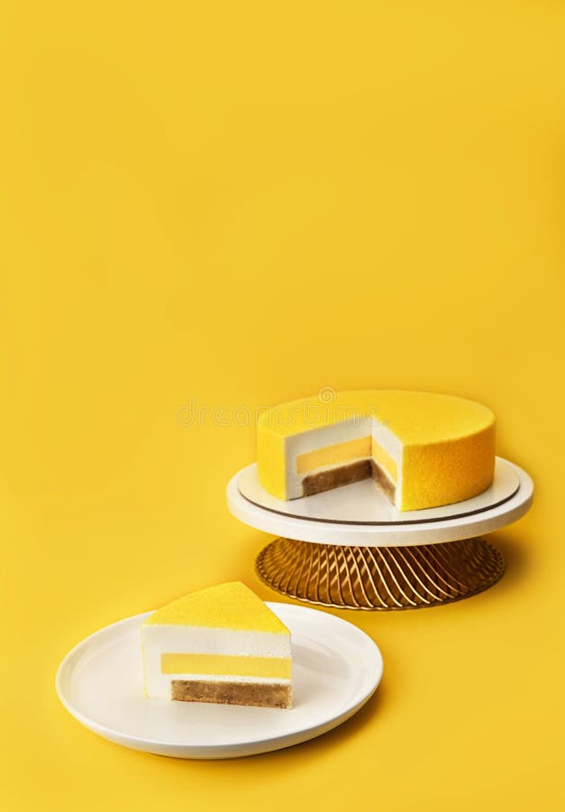 Delicious Mango and Passion Fruit Mousse Cake on a Stand and Slice with ...