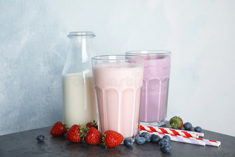 Delicious Milk Shakes and Ingredients on Table Stock Image - Image of ...