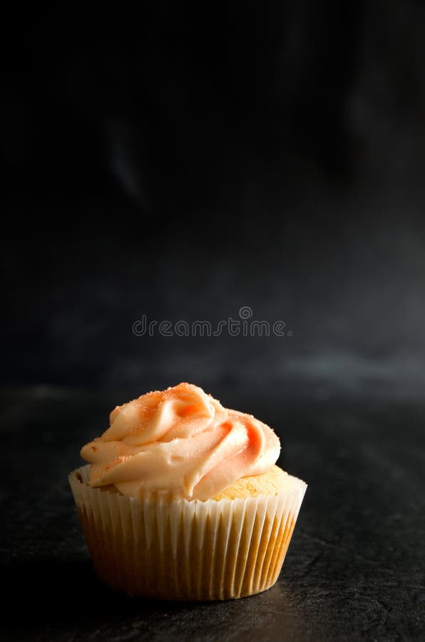 Delicious Muffin with Icing and Sugar on Dark Background Stock Photo ...