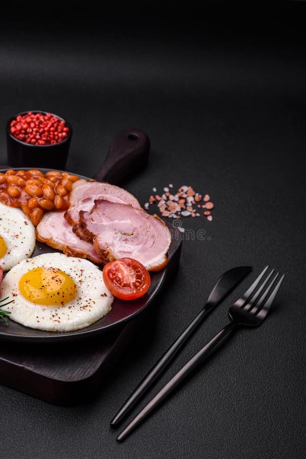 Delicious Nutritious English Breakfast with Fried Eggs and Tomatoes ...