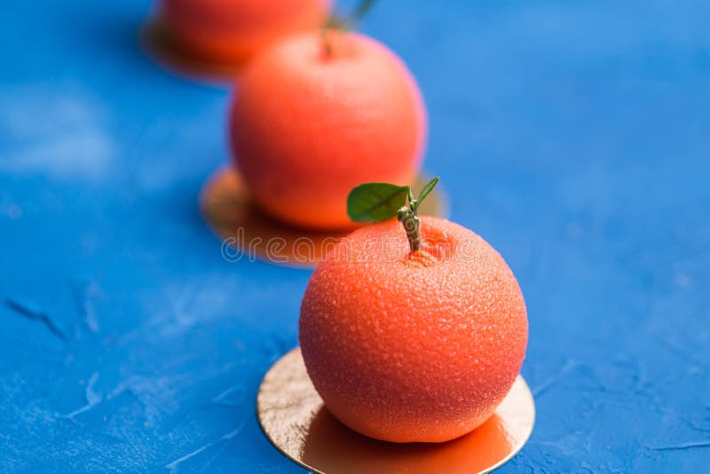 Sweets, Cake and Dessert Concept - Delicious Orange Cake in Orange ...