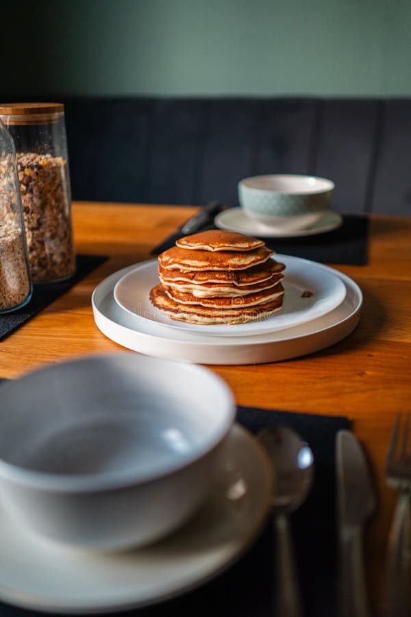 Delicious Pancake Stack on a Plate of a Wooden Breakfast Table Stock ...