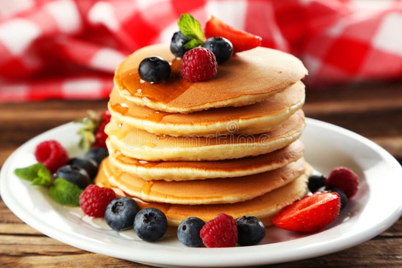 Delicious Pancakes with Berries on a White Wooden Background Stock ...