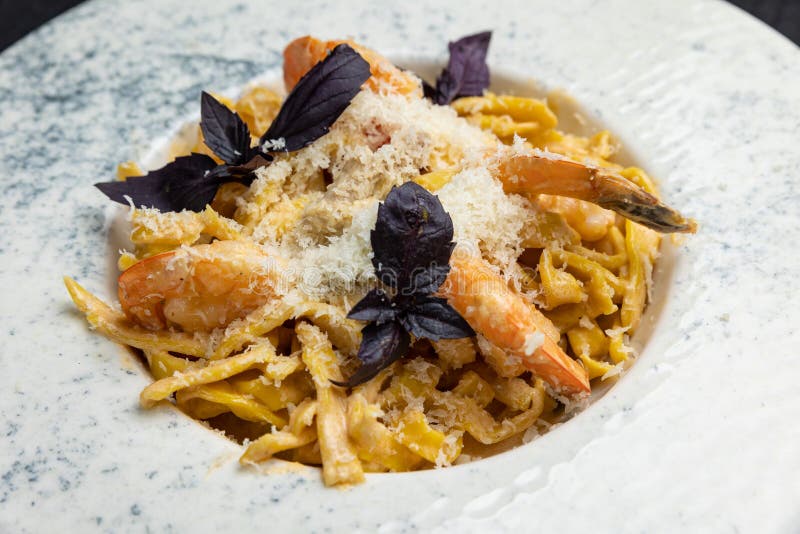 Delicious Pasta on a Dark Table in a Restaurant Stock Image - Image of ...