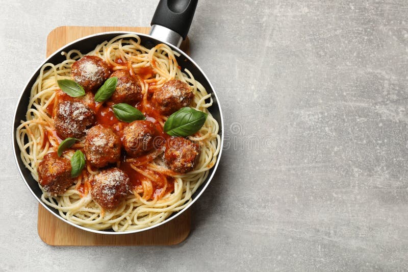 Delicious Pasta with Meatballs on Light Grey Table, Top View. Space for ...