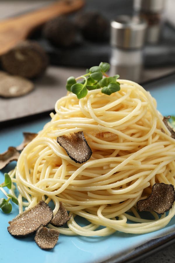 Delicious Pasta with Truffle Slices and Microgreens on Plate, Closeup ...