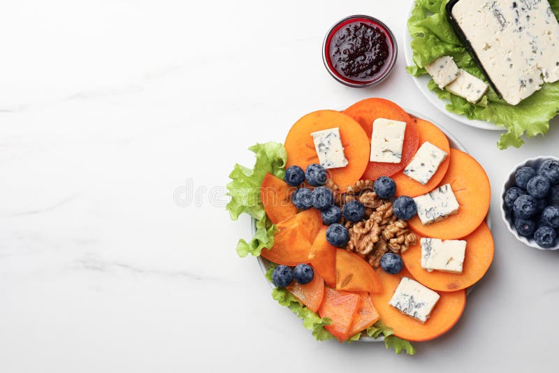 Delicious Persimmon with Blue Cheese on White Marble Table, Flat Lay ...