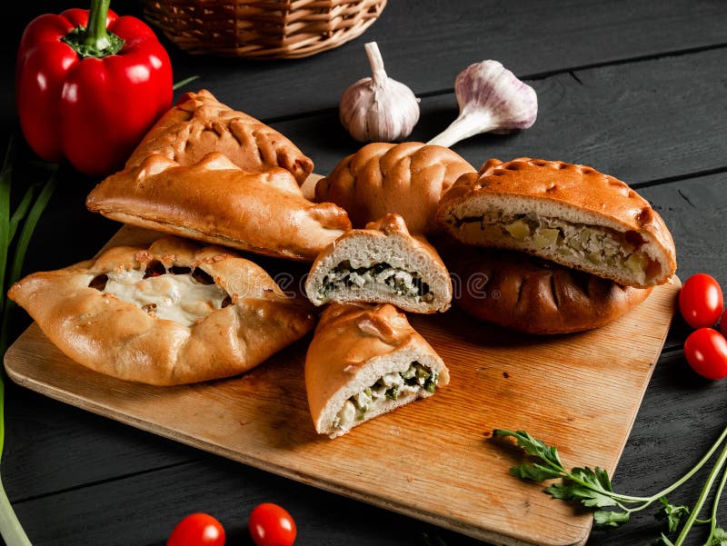 Delicious Pies on a Cutting Board. Composition on a Black Background ...